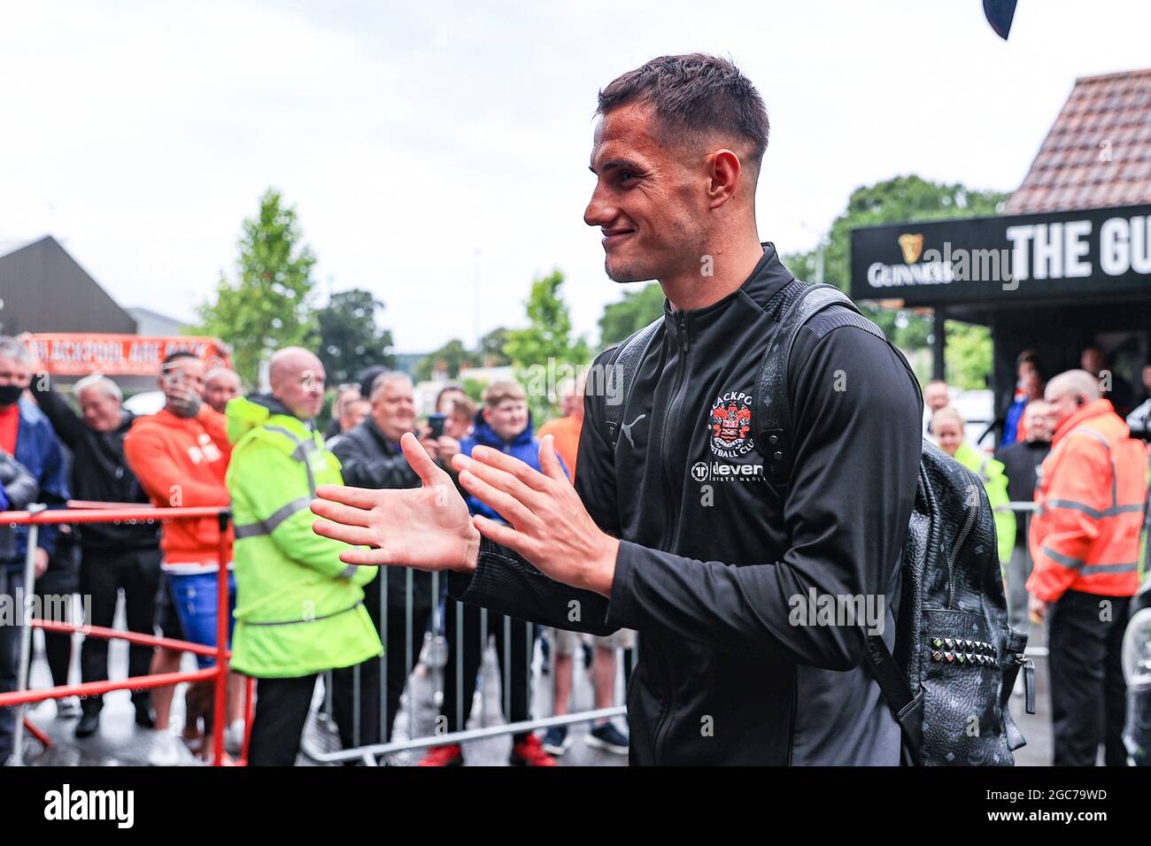 Jerry Yates #9 of Blackpool applauds the traveling fans as he arrives ...