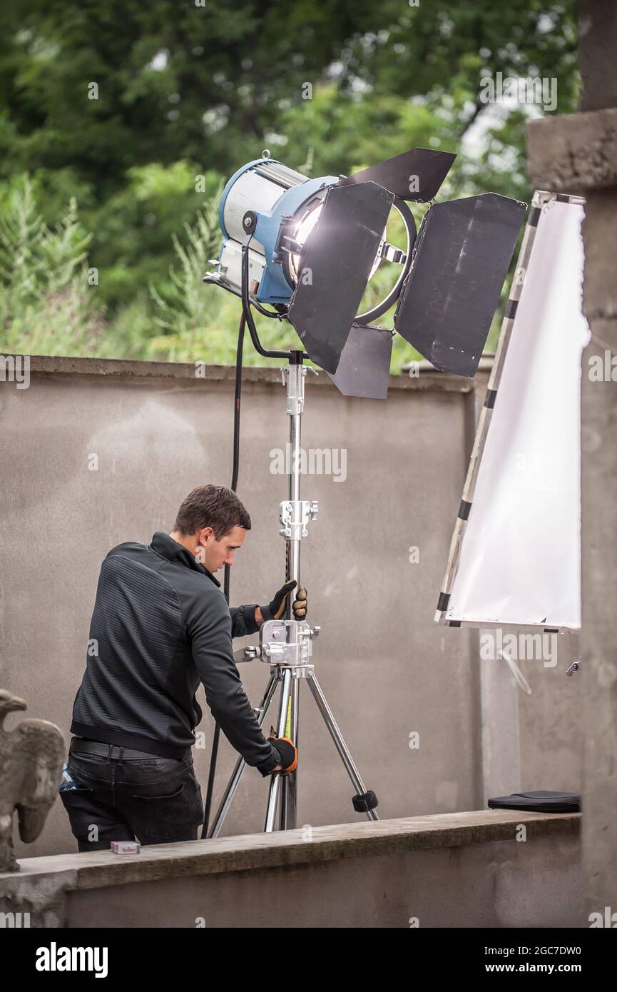 Behind the scene. Filmmaking lighting technician electric engineer ...