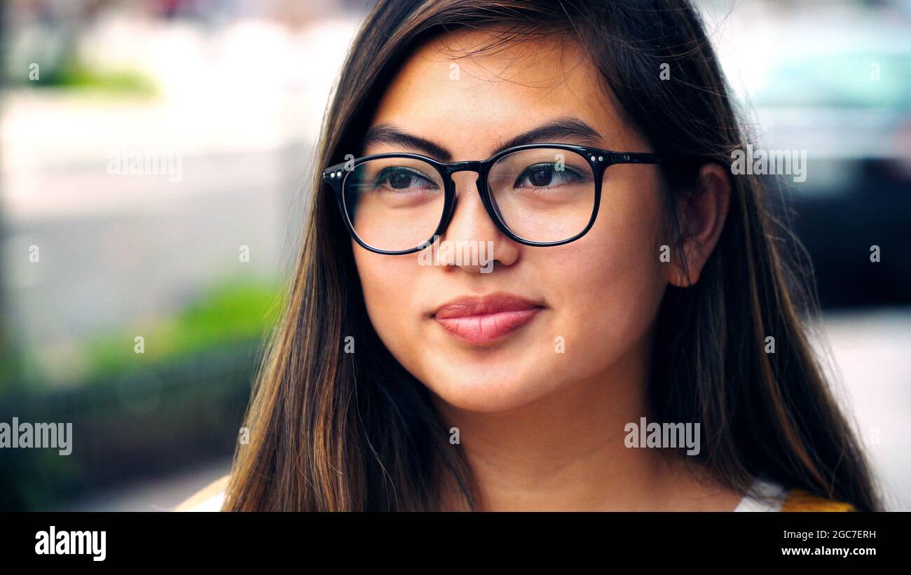 East Asian female wearing glasses with a smart face captured in the US ...