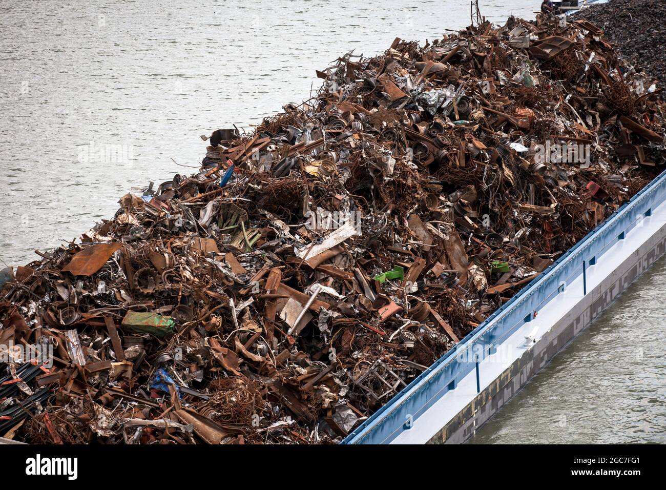 cargo ship with scrap metal entering the Rhine port Niehl, Cologne ...