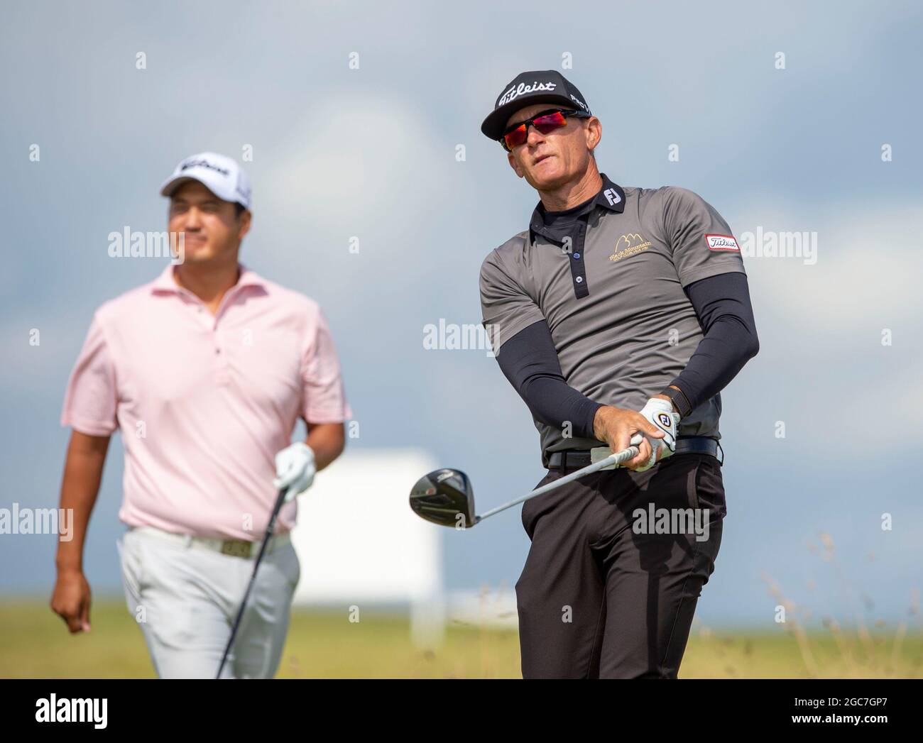 USA's Berry Henson tees off at the 2nd watched by USA's Sihwan Kim ...