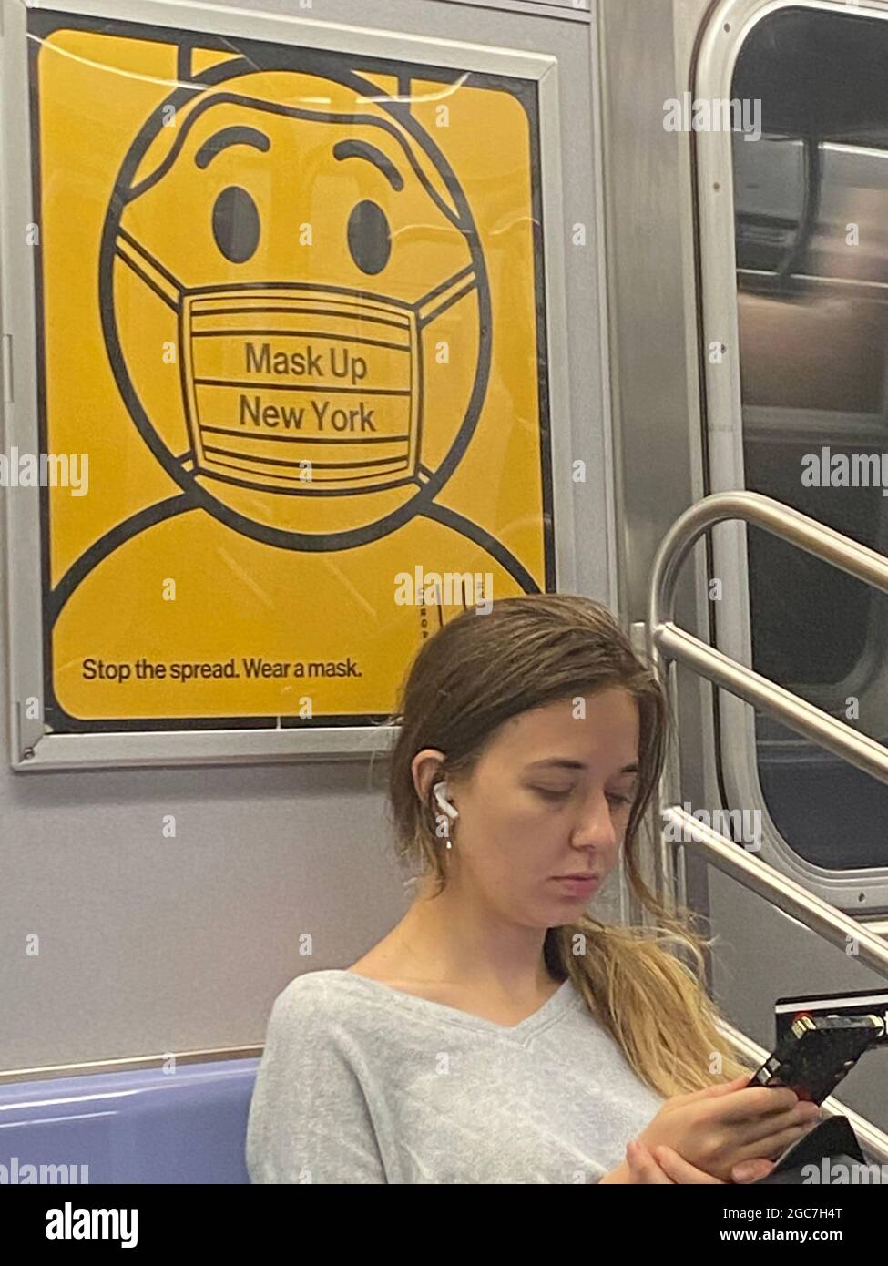 Subway disconnect: Woman rides a subway train maskeless sitting just ...