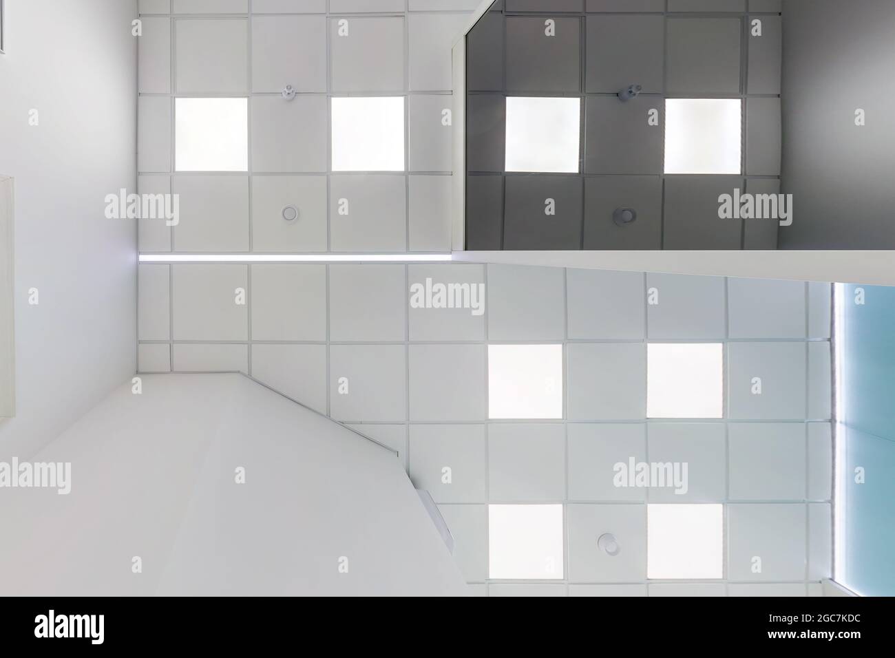 cassette suspended ceiling with square halogen spots lamps and drywall ...