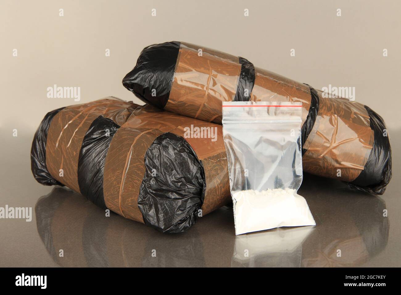 Packages of narcotics on gray background Stock Photo - Alamy