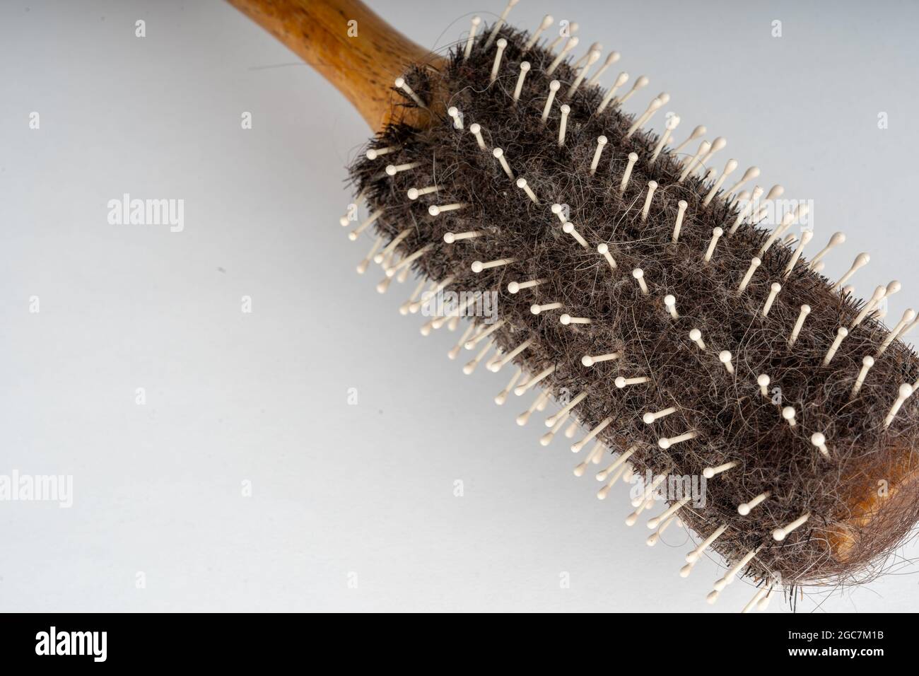 Close up of old dirty hairbrush. Comb with different hair on white ...