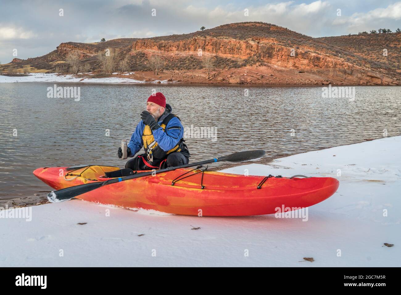 hot tea stop during winter kayaking - recreation concept, cold season ...