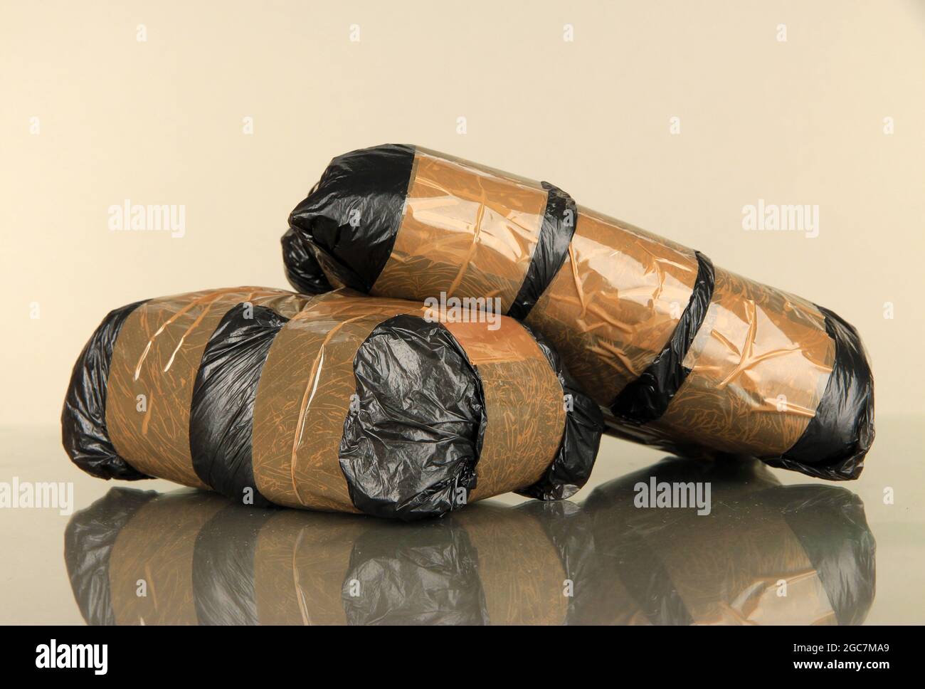 Packages of narcotics on gray background Stock Photo - Alamy