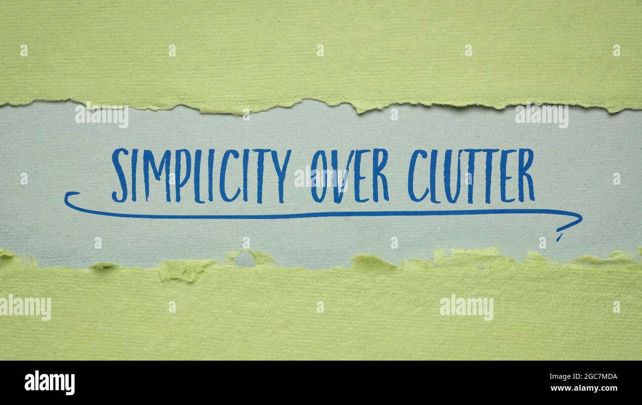 simplicity over clutter inspirational banner, handwriting on handmade ...