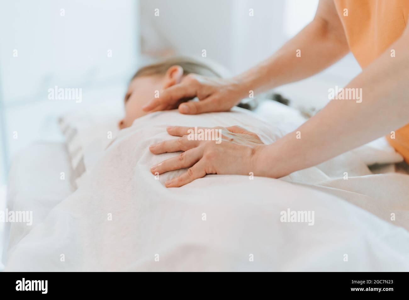 real doctor osteopath hands does physiological and emotional therapy ...