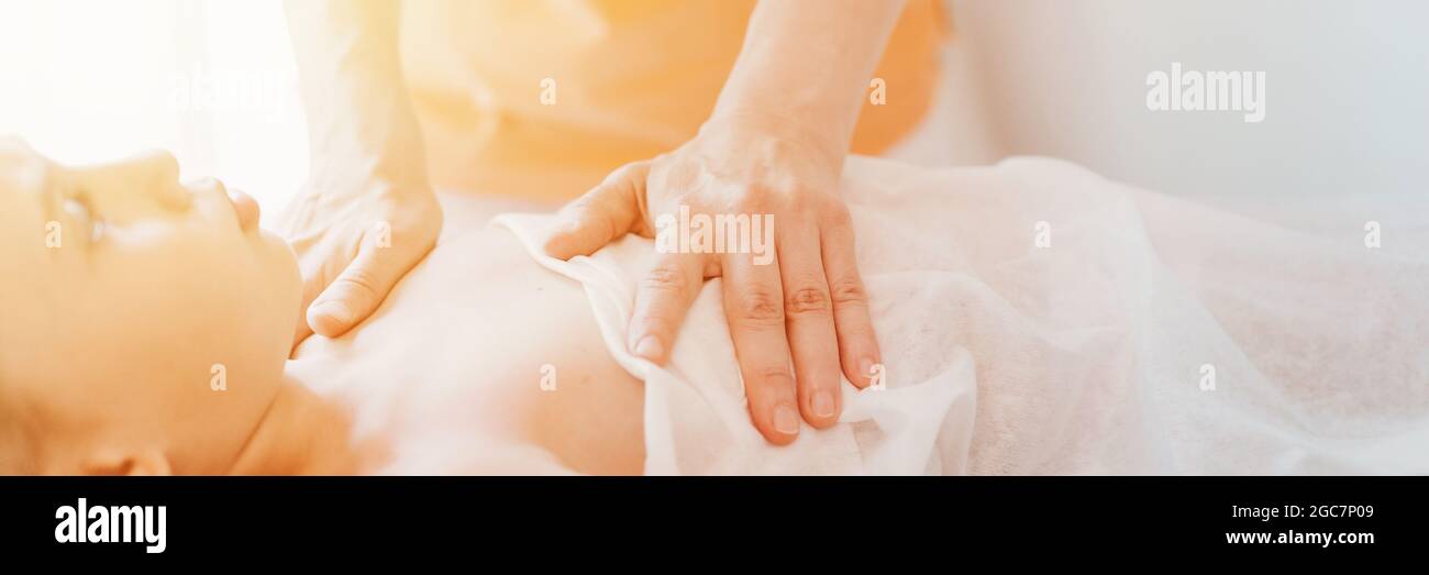 real doctor osteopath hands does physiological therapy for eight year ...