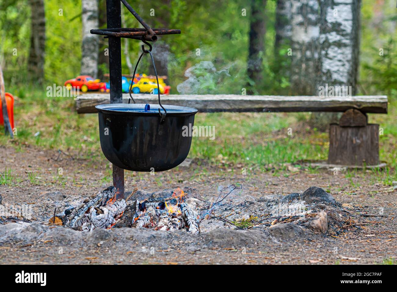 cooking food on a campfire in the woods, food camping concept, place ...