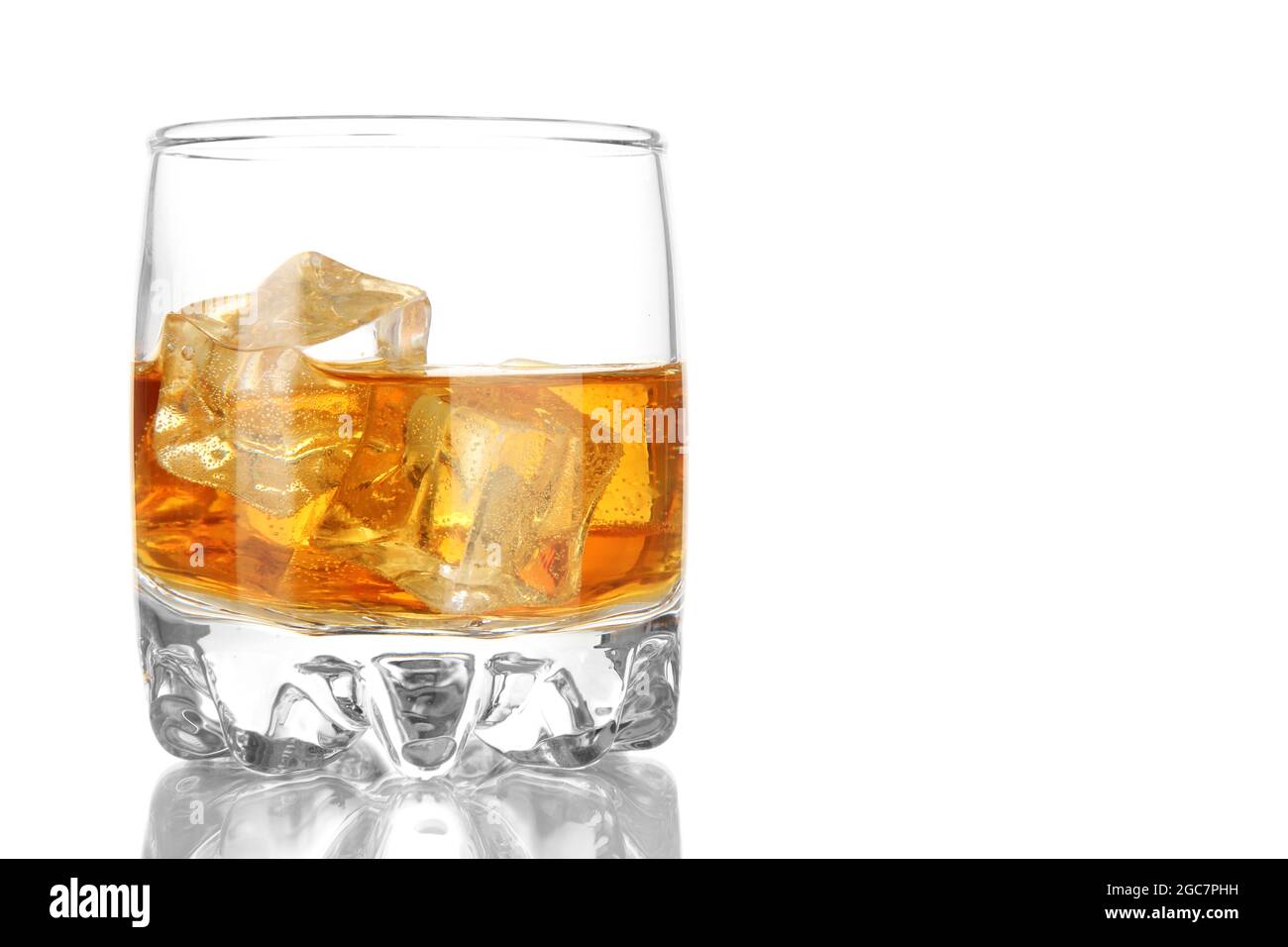 Brandy glass with ice isolated on white Stock Photo - Alamy