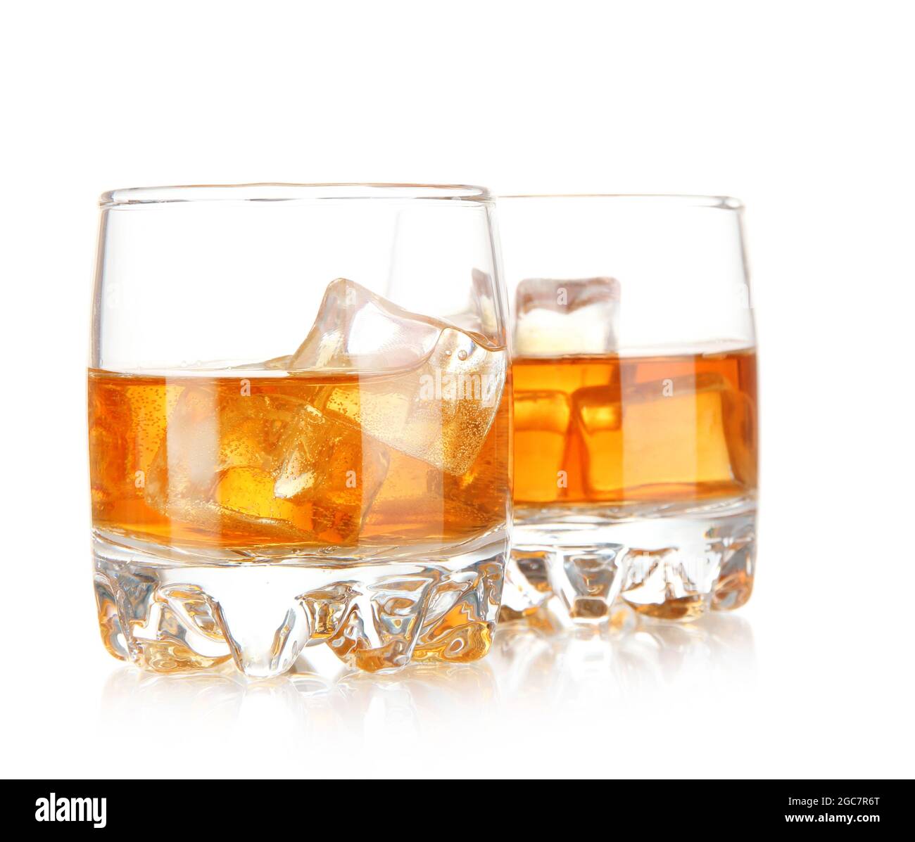 Brandy glasses with ice isolated on white Stock Photo - Alamy