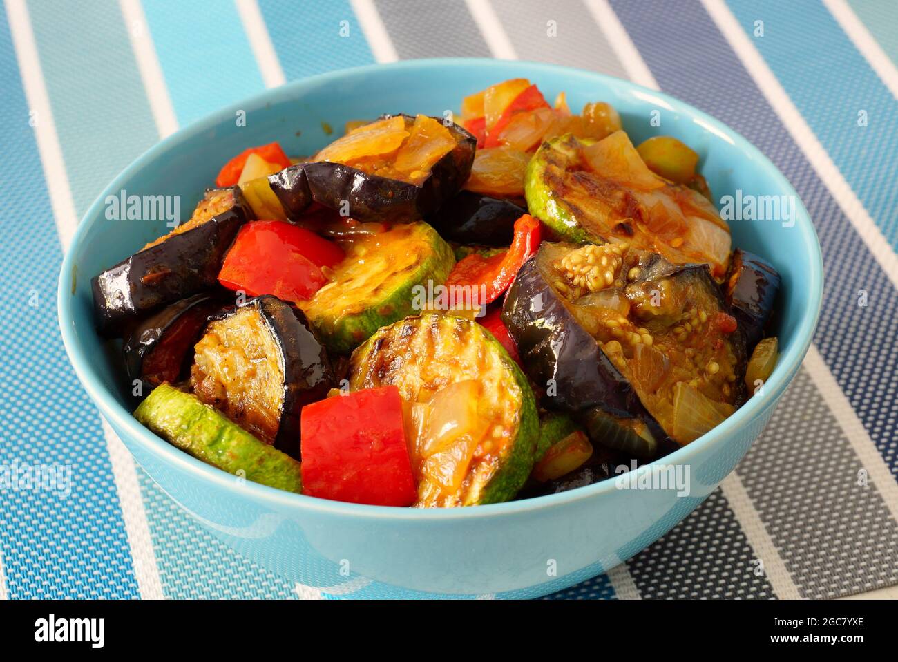 Ratatouille. Vegetable stew with eggplant, zucchini and bell peppers in ...