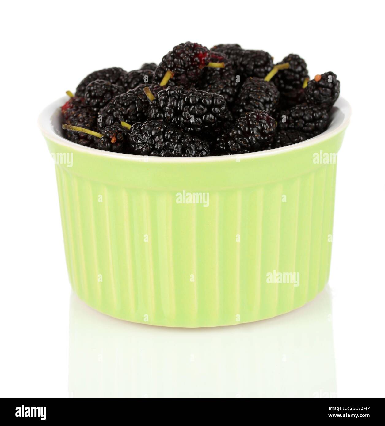 Ripe mulberries in bowl isolated on white Stock Photo - Alamy