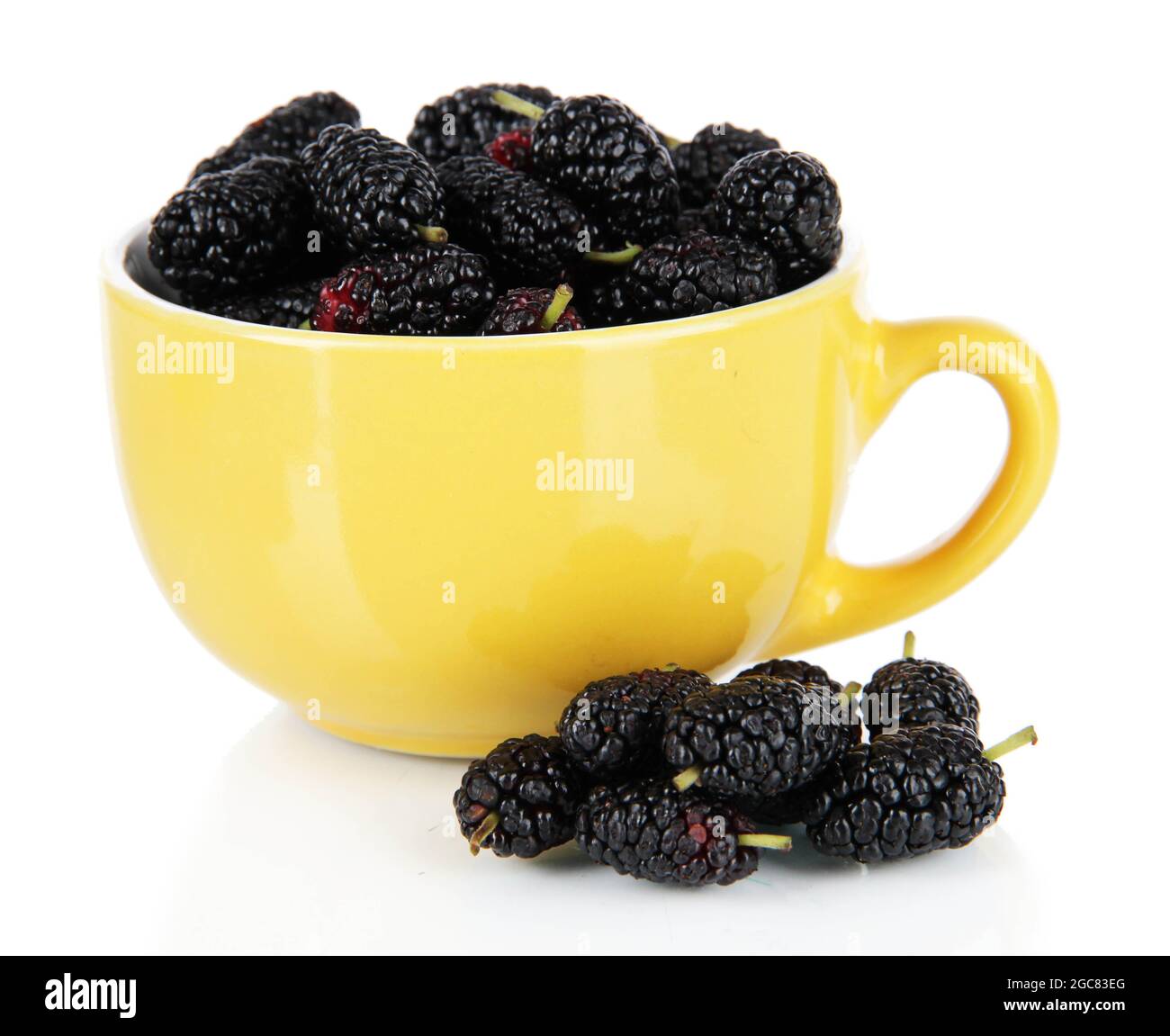 Ripe mulberries in cup isolated on white Stock Photo - Alamy