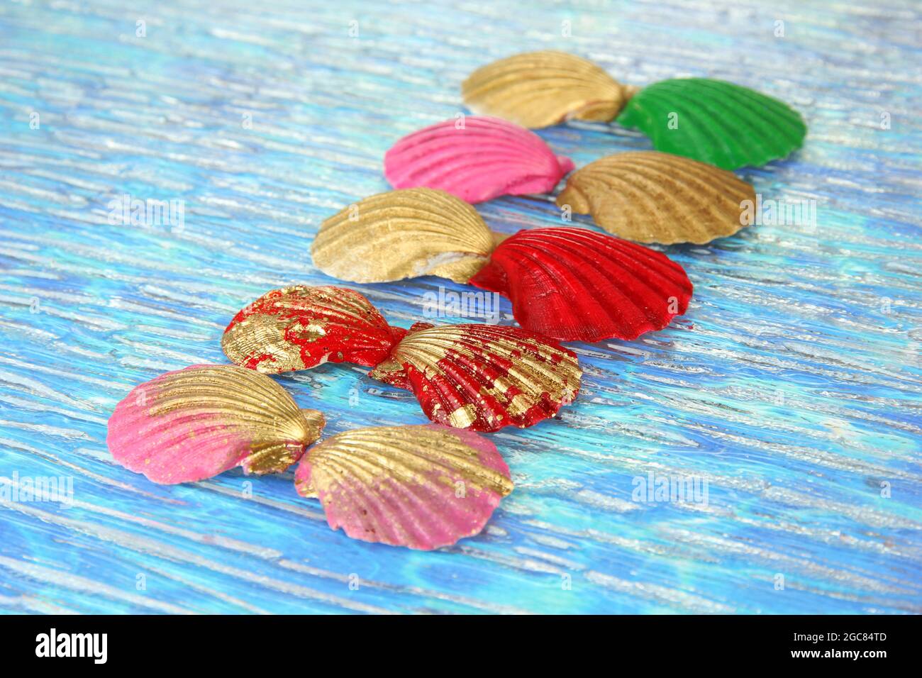 Colorful seashells on bright background Stock Photo - Alamy