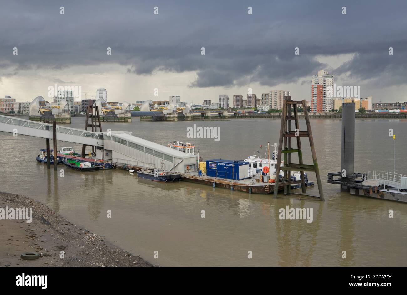 Views of river Thames barrier and Canary Wharf from Woolwich docks ...