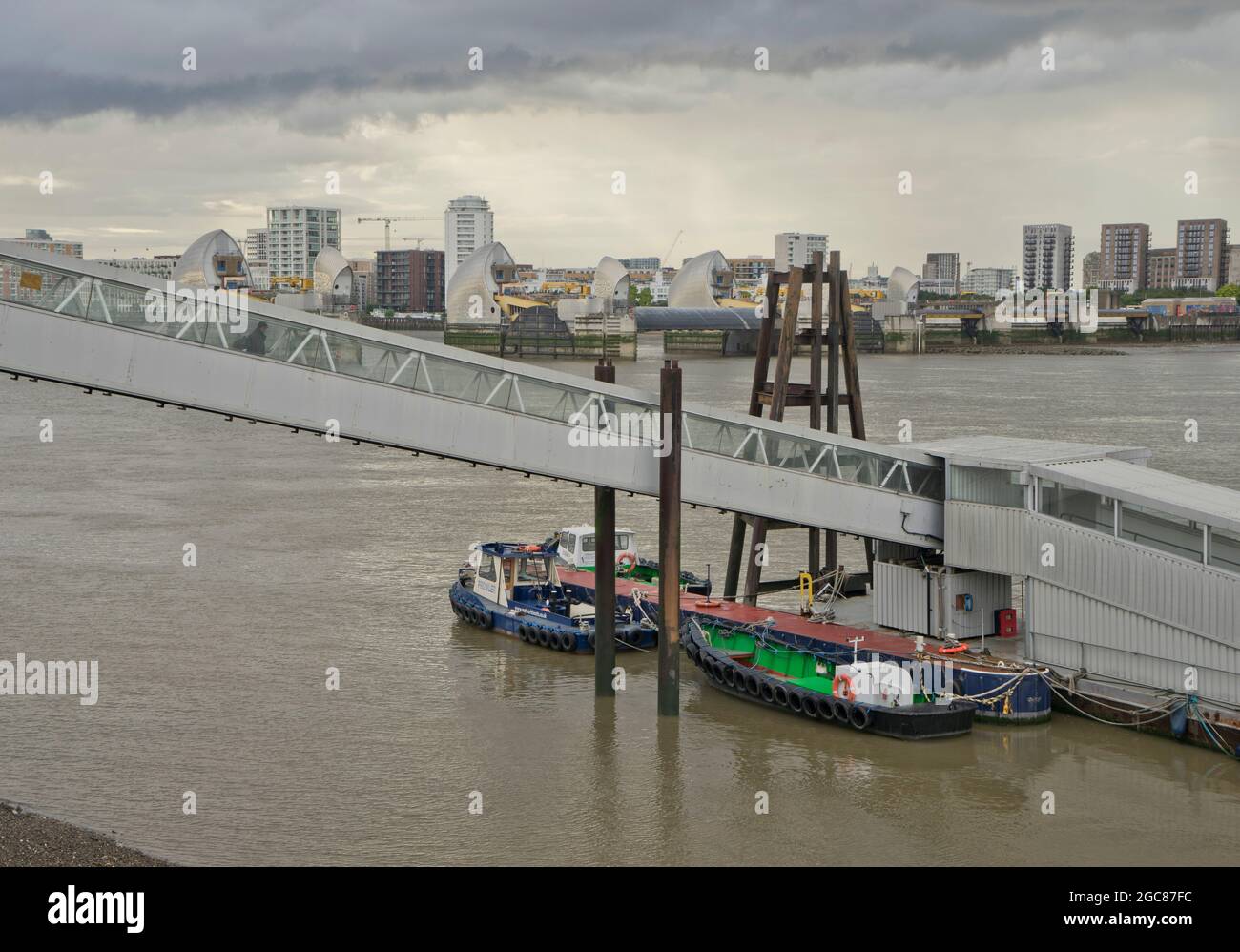 Views of river Thames barrier and Canary Wharf from Woolwich docks ...