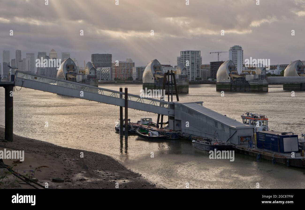 Views of river Thames barrier and Canary Wharf from Woolwich docks ...