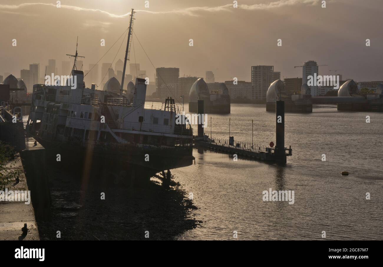 Views of river Thames barrier and Canary Wharf from Woolwich docks ...