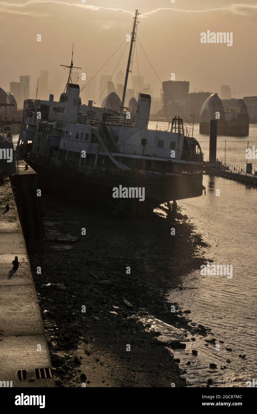 Views of river Thames barrier and Canary Wharf from Woolwich docks ...