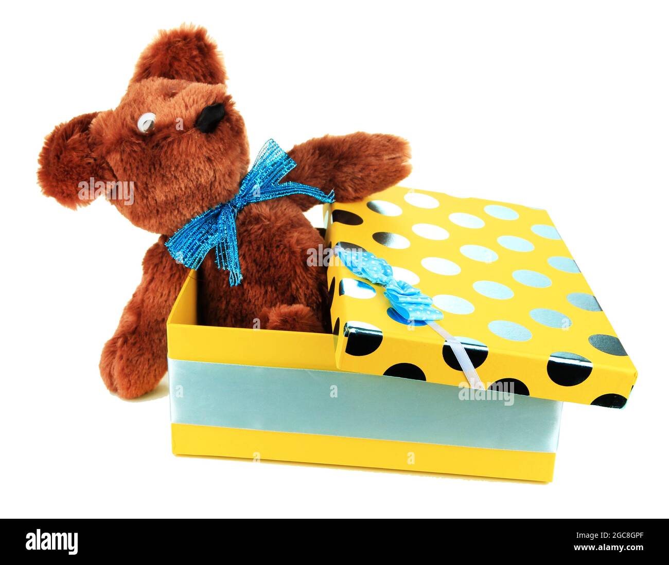 Yellow gift box with toy isolated on white Stock Photo - Alamy