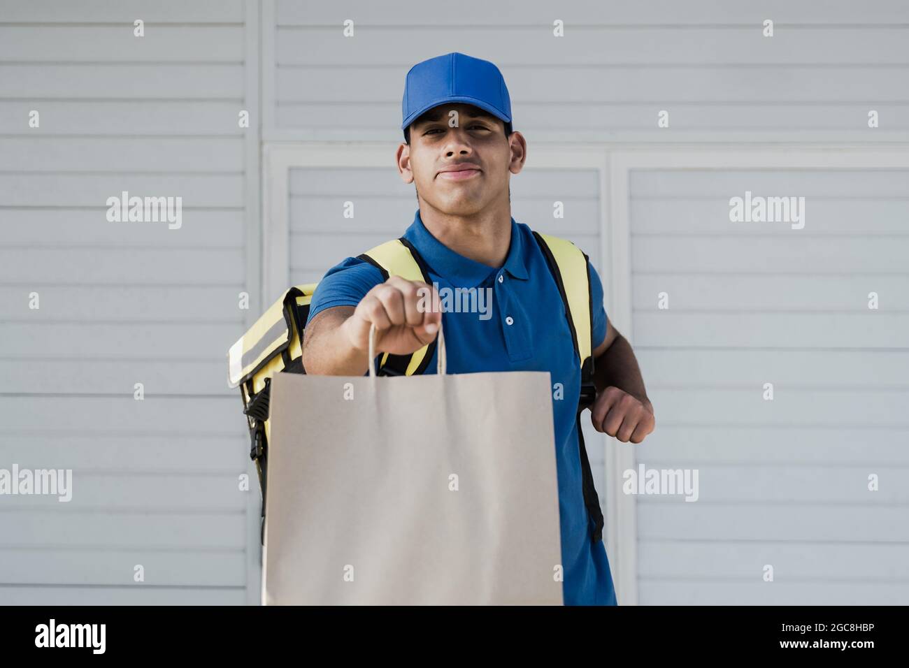 African american delivery man delivering fast food meal package in ...