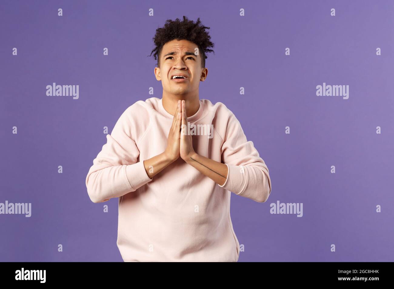 Portrait of young distressed and devestated hispanic guy pleading to ...