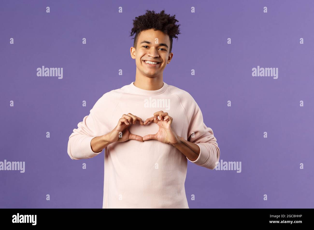 Portrait of young happy, romantic lovely boyfriend express his love and ...