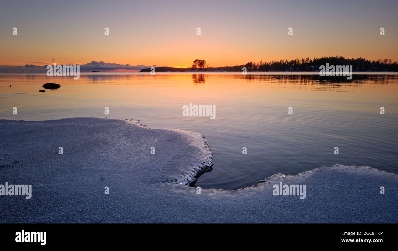 sunrise over the lake and snow and ice in the foreground Stock Photo ...