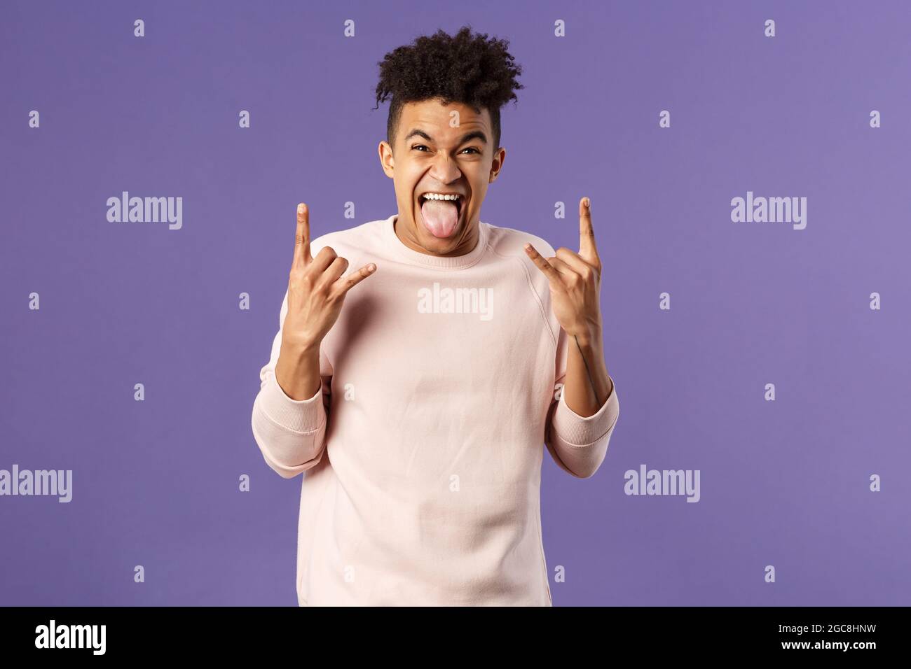 Portrait of enthusiastic, excited funny young man having fun, enjoying ...