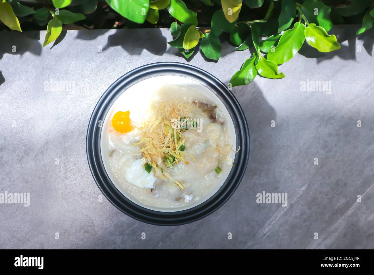 rice gruel or rice porridge or congee with pork liver, pork ball and ...