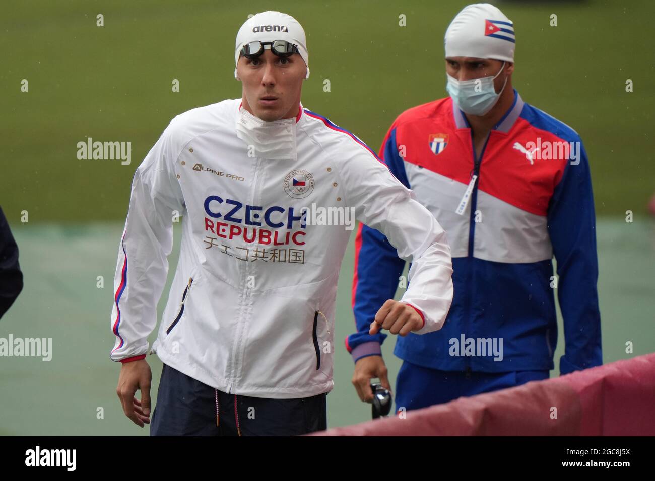 Czech athlete Jan Kuf, left, attends swimming portion of the men's ...