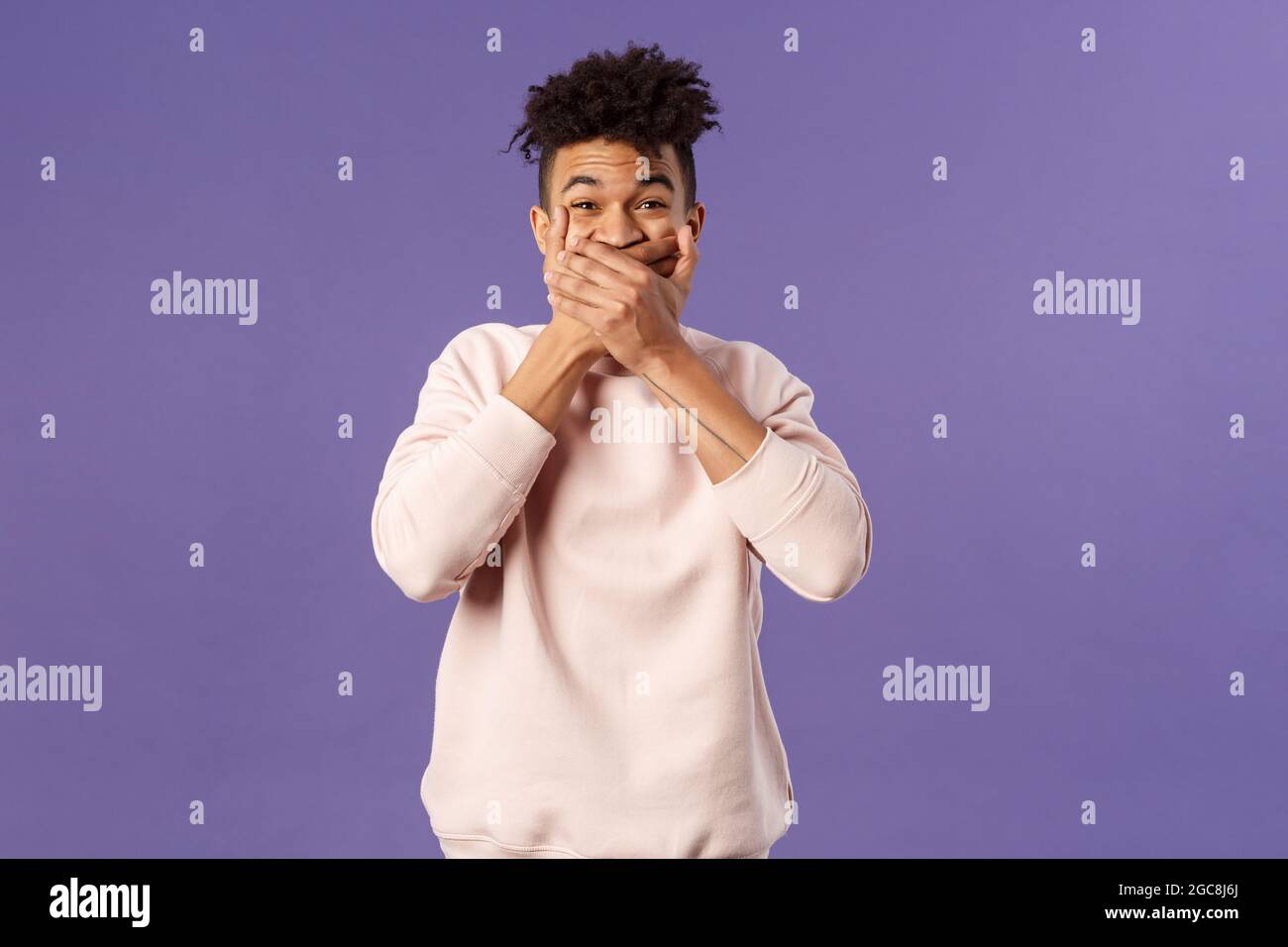 Portrait of amused, funny and carefree male student fooling around ...