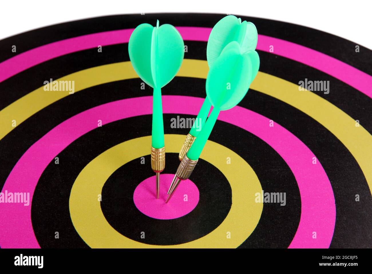 Target with darts close-up Stock Photo - Alamy