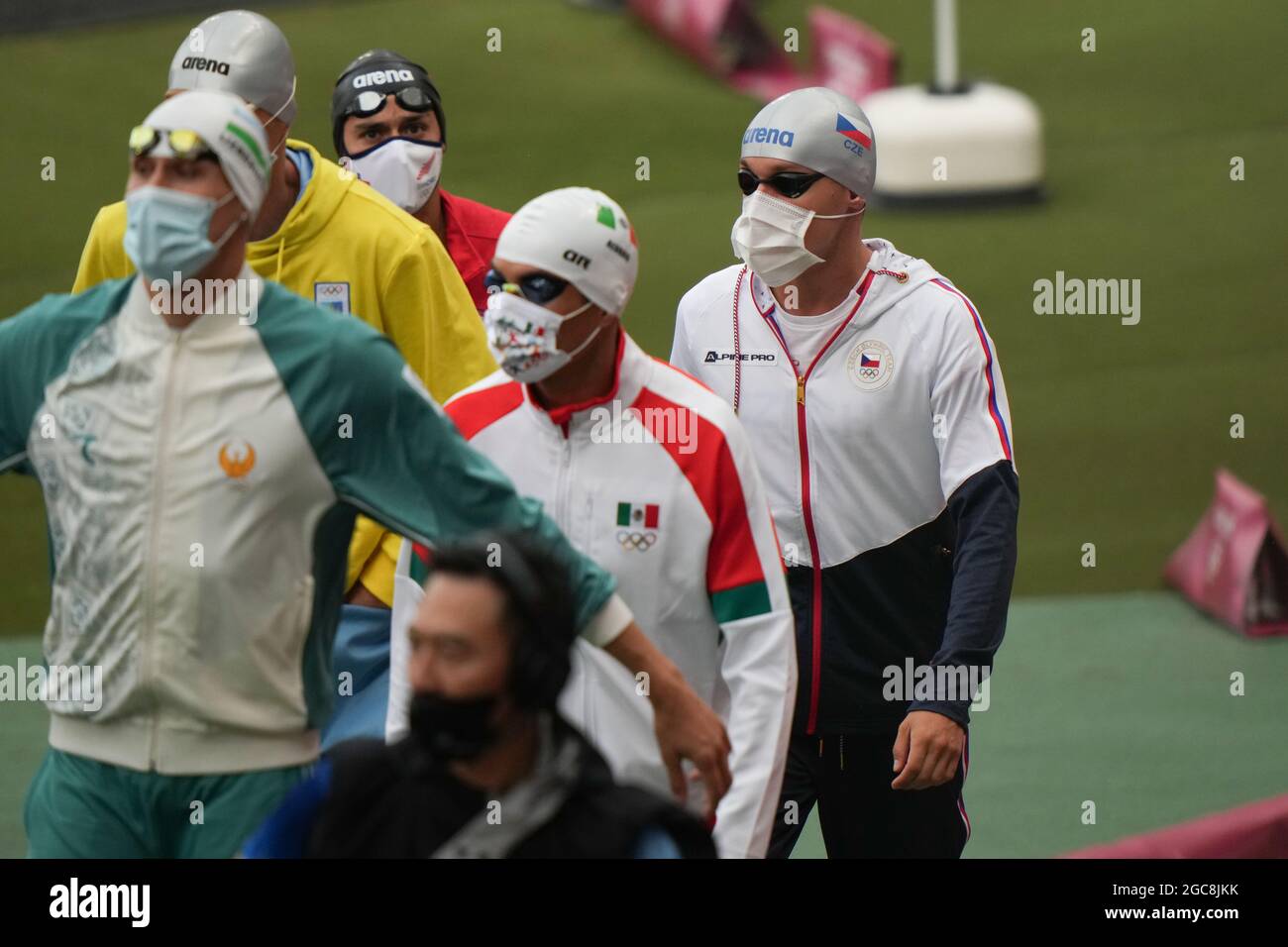 Czech athlete Martin Vlach, right, attends swimming portion of the men ...
