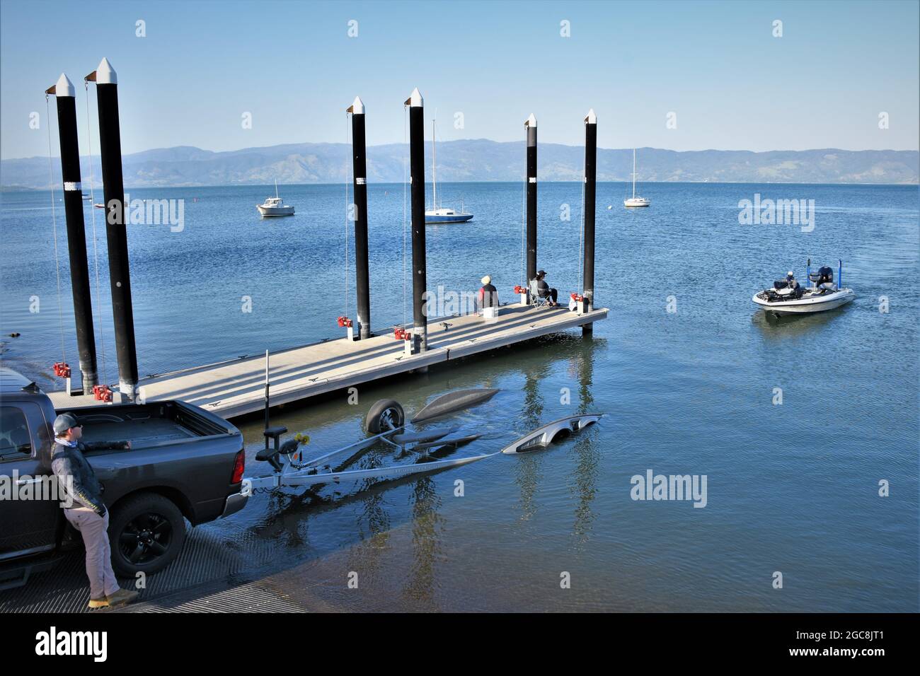 End of fishing day on Clearlake, northern CA, summer, docking bass boat ...