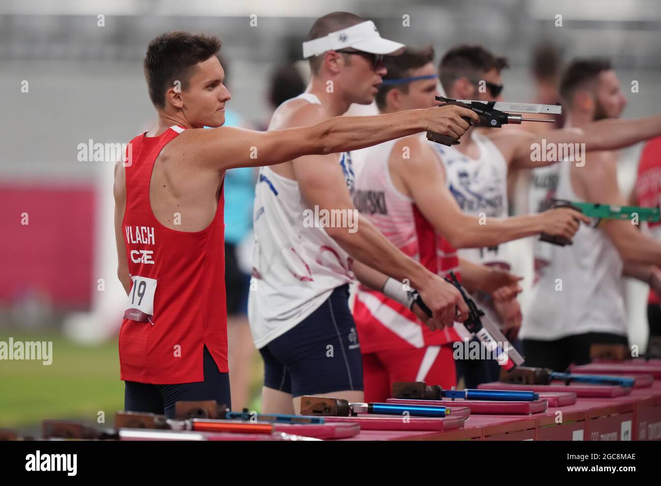 Czech athlete Martin Vlach, left, attends laser run shooting portion of ...