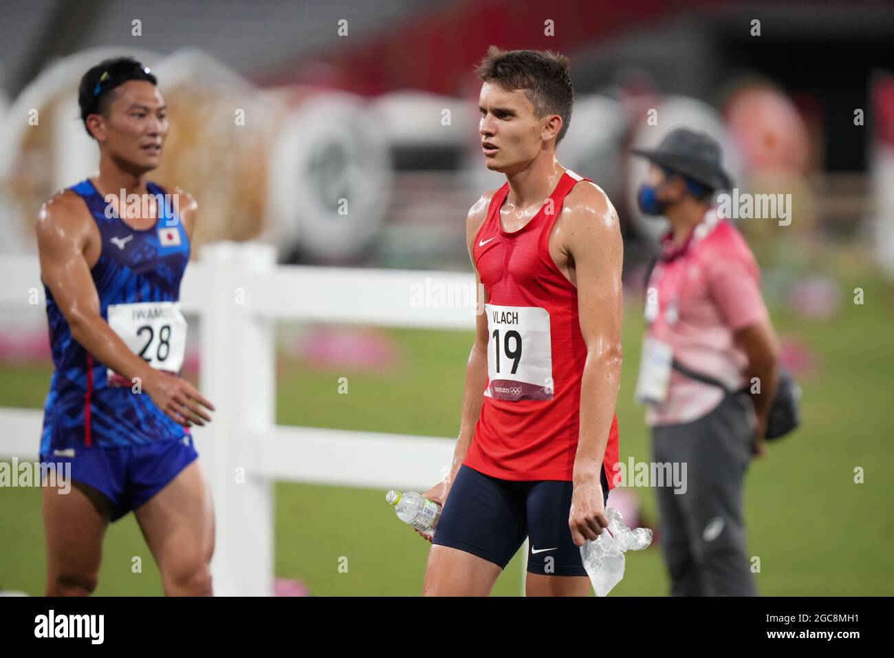 Czech athlete Martin Vlach, right, attends laser run shooting portion ...