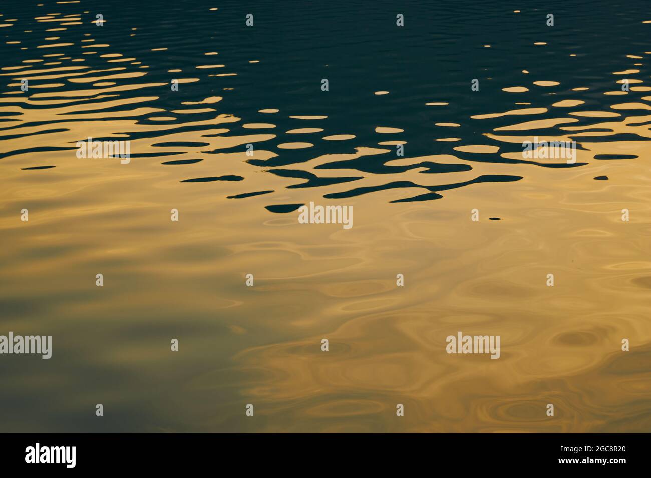 Abstract background water surface reflecting the sun. Wallpaper with ...
