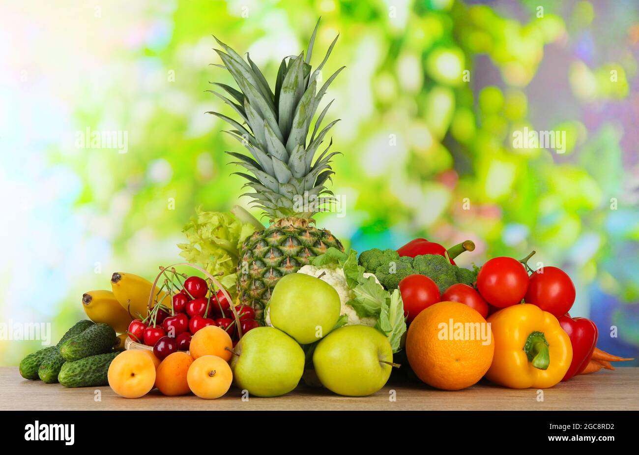 Assortment of fresh fruits and vegetables on natural background Stock ...
