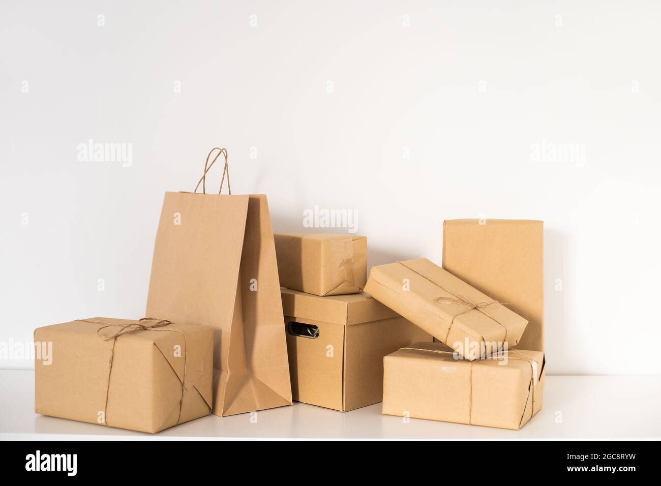 Moving in. Stack of cardboard boxes in the empty room with copy space ...