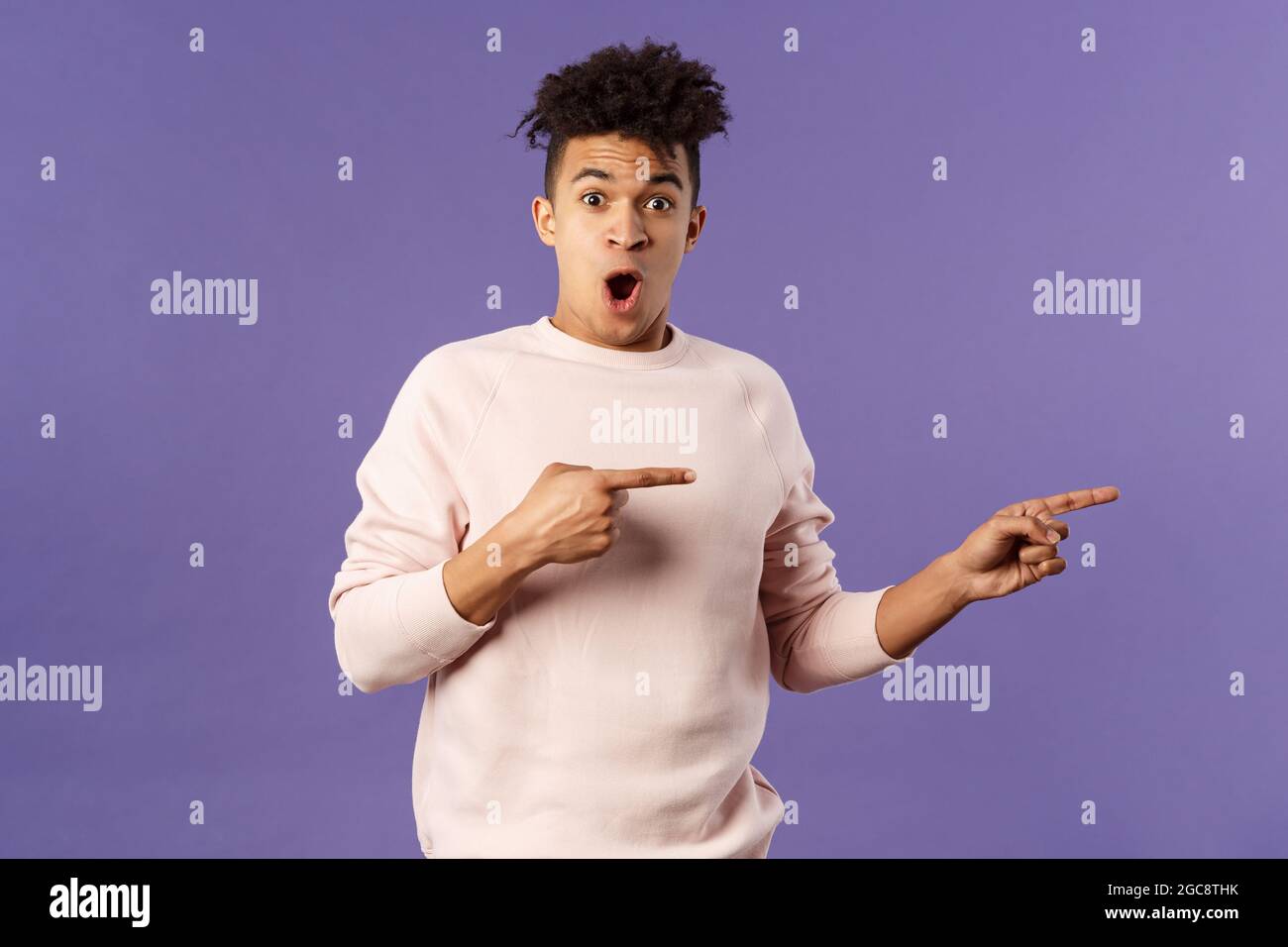 Portrait of excited, handsome young hispanic man talking about amazing ...