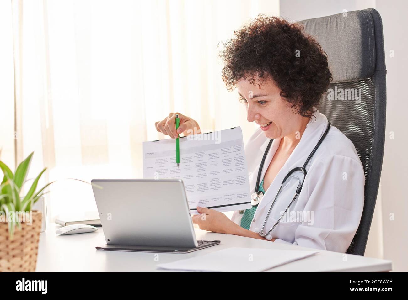 Woman doctor in an online medical consultation via video call Stock ...