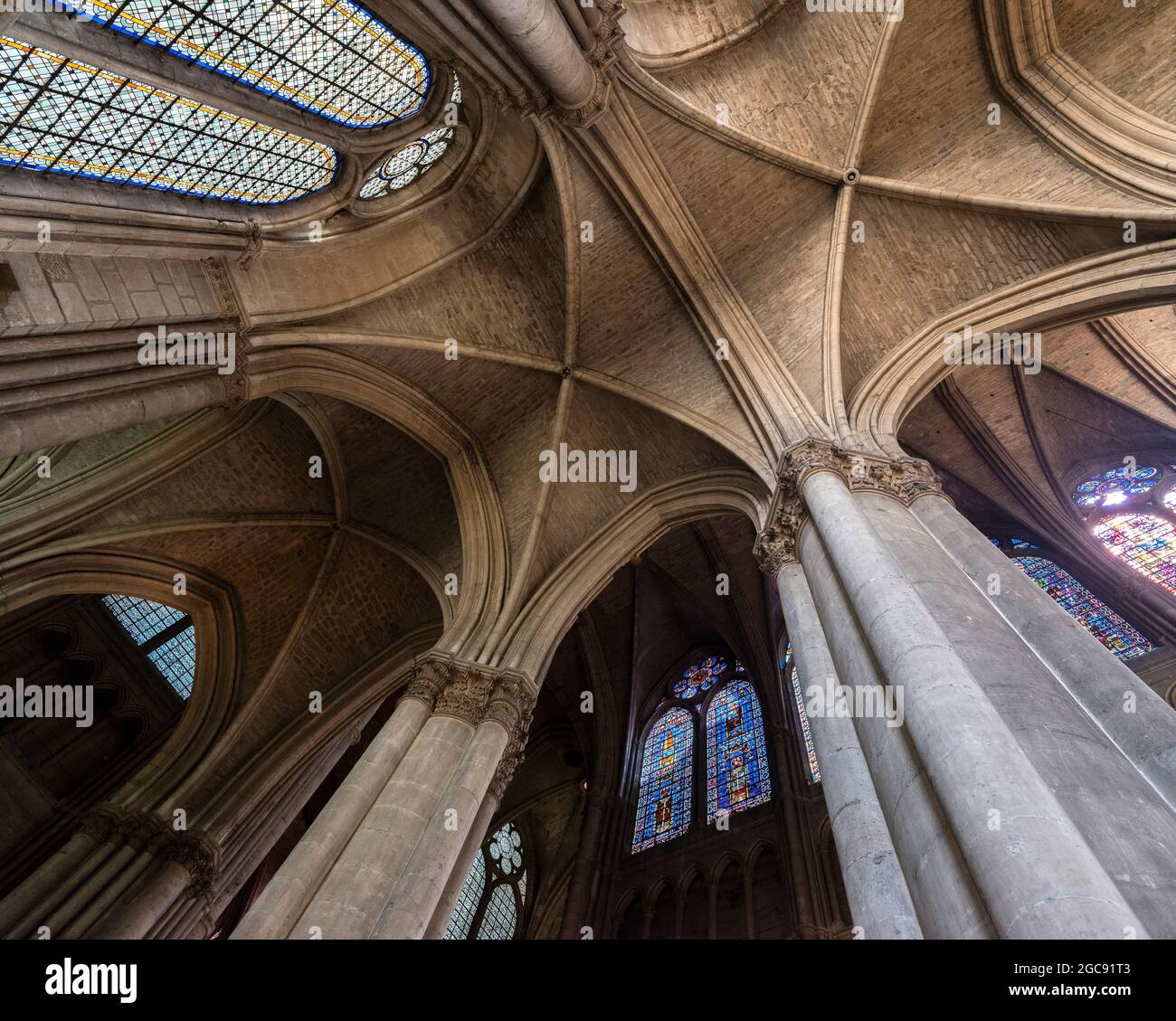vaults and stained glass windows inside cathedral of reims in the north ...