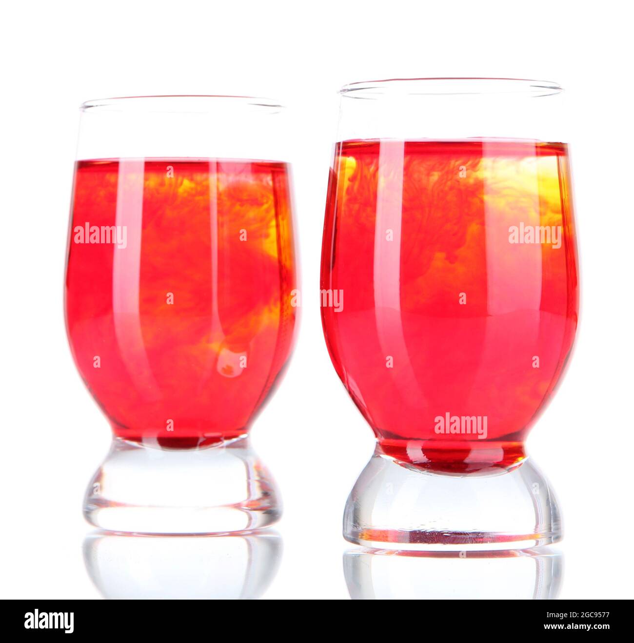 Glass of red water isolated on white Stock Photo - Alamy