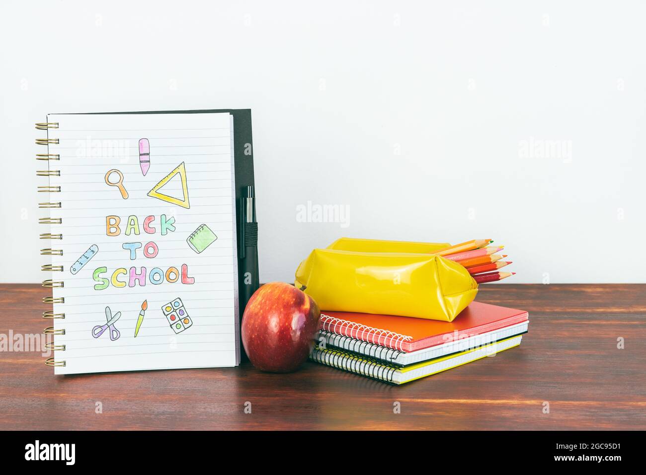 Notebook with back-to-school drawing. Apple and study notebooks with ...