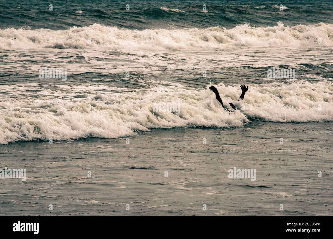 Man in waves hi-res stock photography and images - Alamy