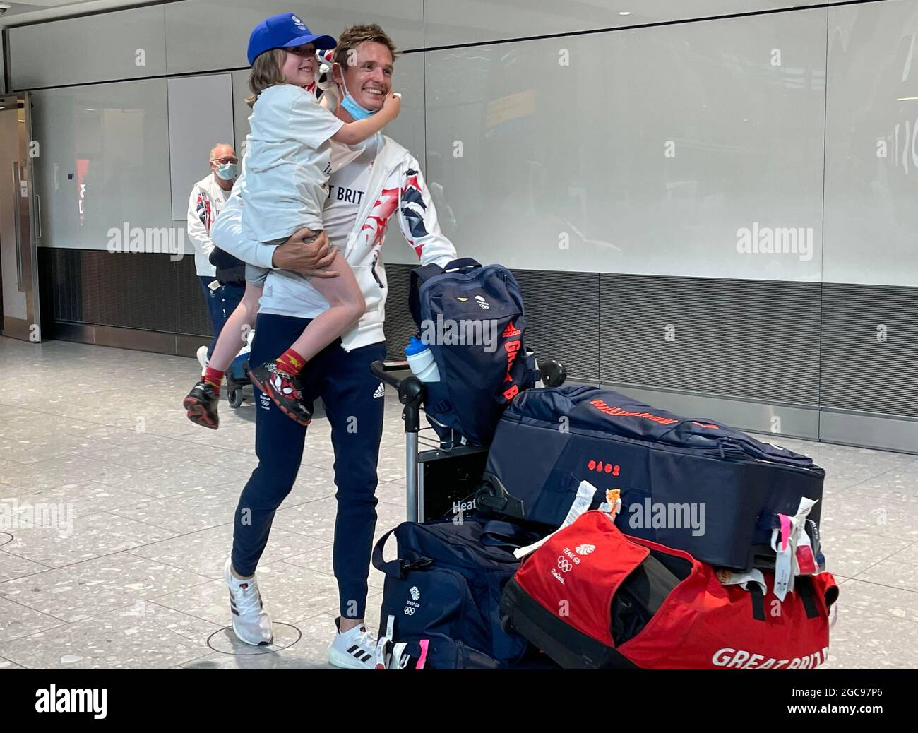 Gold medal winning sailor Dylan Fletcher is reunited at Heathrow ...